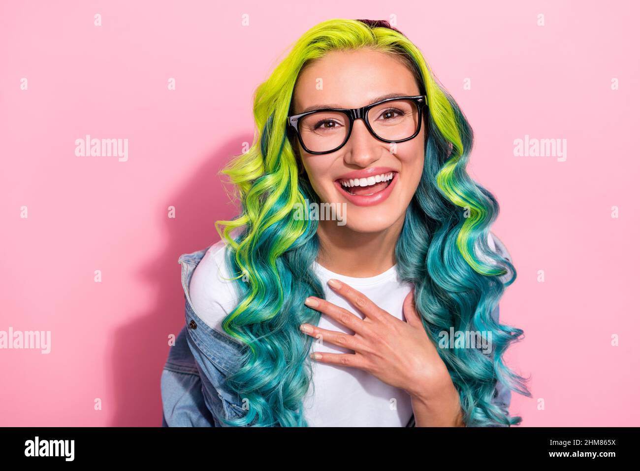 Photo of cute impressed young vibrant woman wear jeans shirt spectacles ...