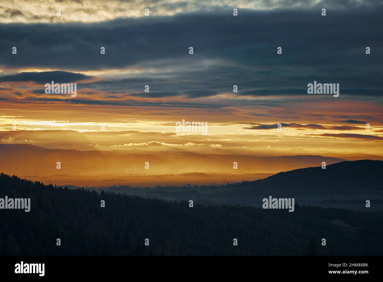 Sunset with dramatic cloudy sky over mountains shape, beautiful nature ...
