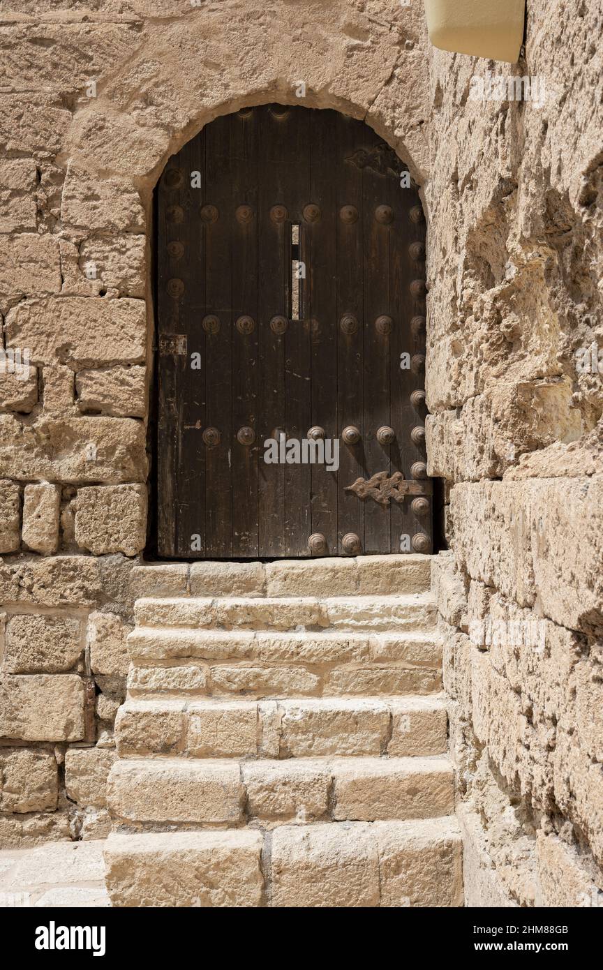 Ancient large wooden door in the wall of the citadel Stock Photo - Alamy