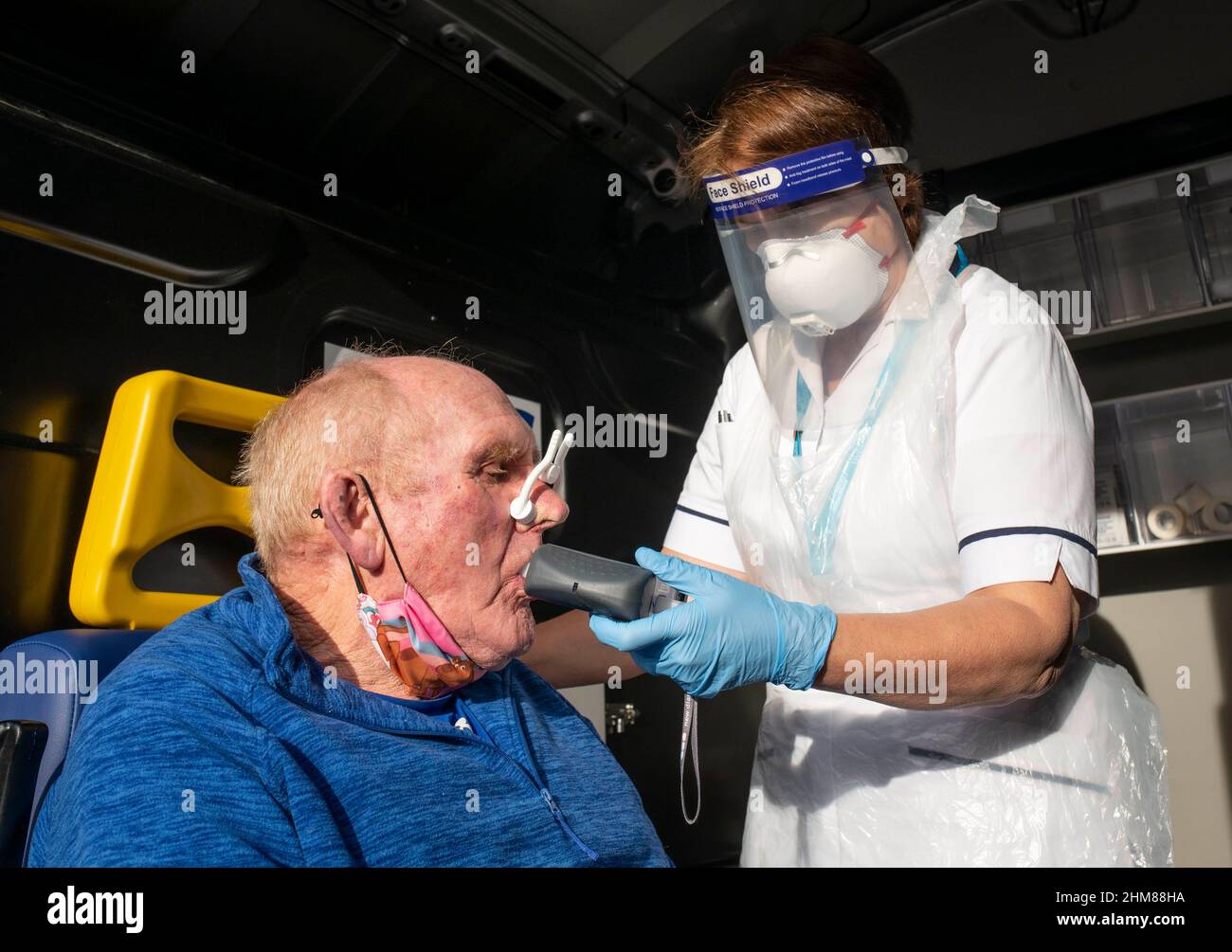 EDITORIAL USE ONLY (Left to right) Mick Purdy, 74, is given a ...