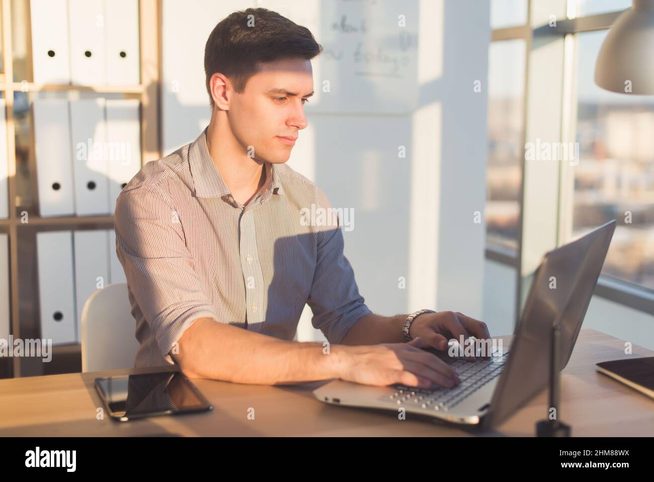 Man typing text or blog in office, hir workplace, using pc keyboard. Busyman working Stock Photo ...