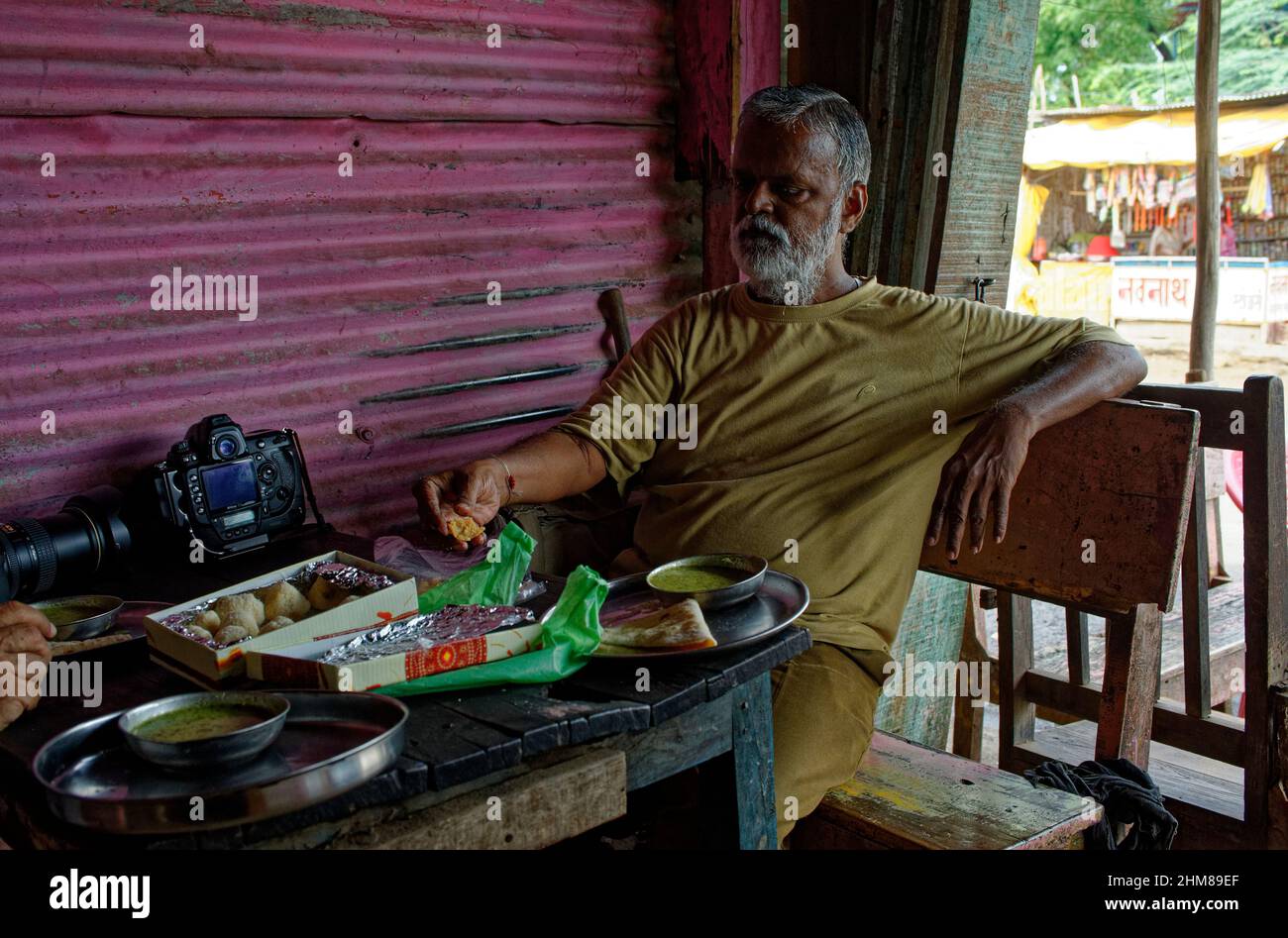 Man eating sweets in a hotel Stock Photo - Alamy
