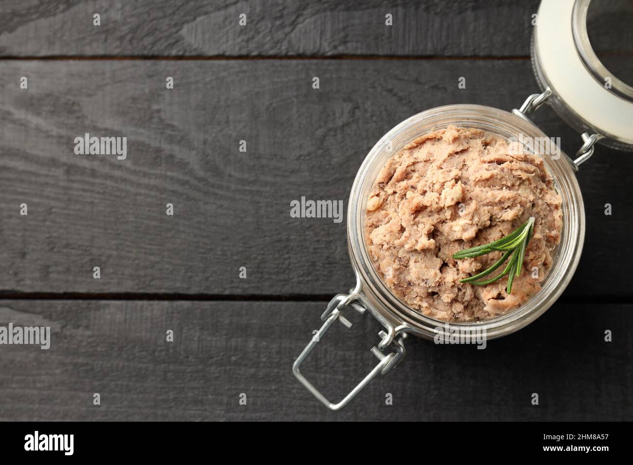 Glass jar of pate on dark wooden background Stock Photo - Alamy