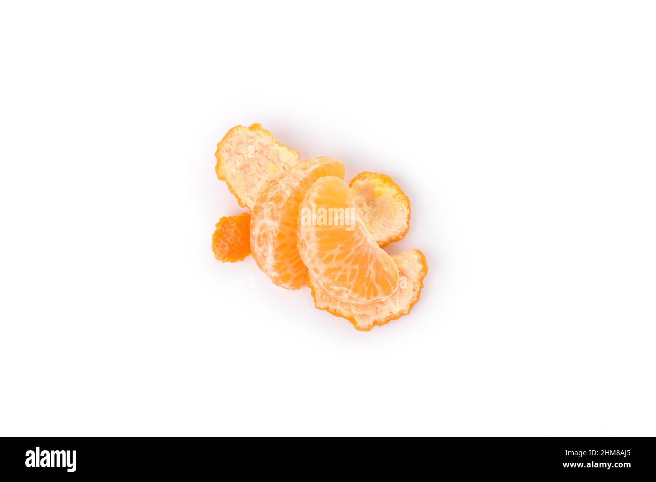 Mandarin pieces on peel isolated on white background Stock Photo - Alamy