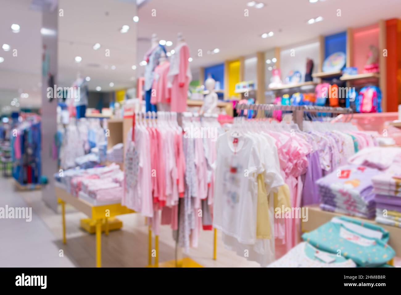 Blurred showcases fashion boutique Clothing store in a modern shopping ...