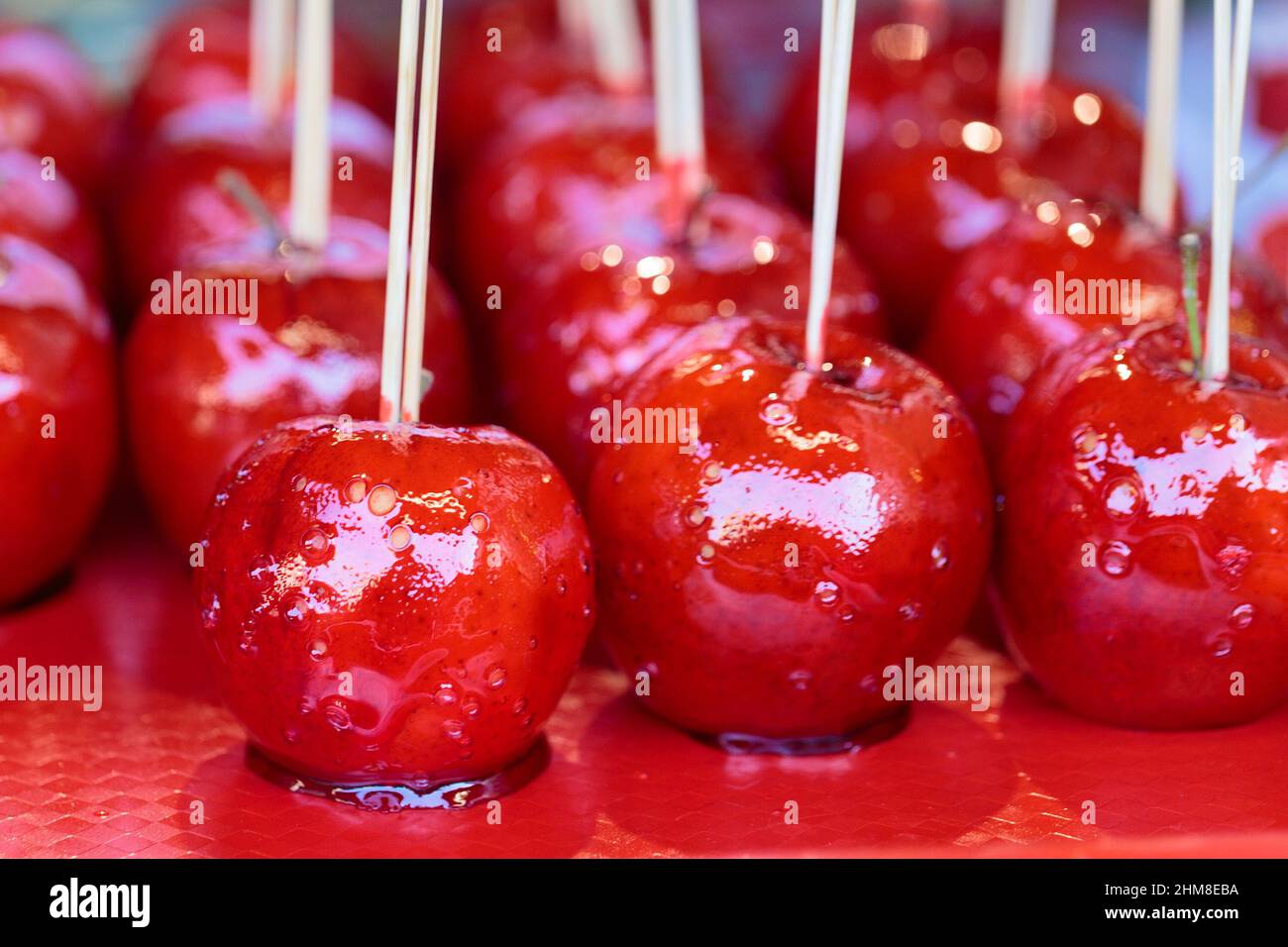Red sweet candy apples on a sticks at the Christmas market Stock Photo ...