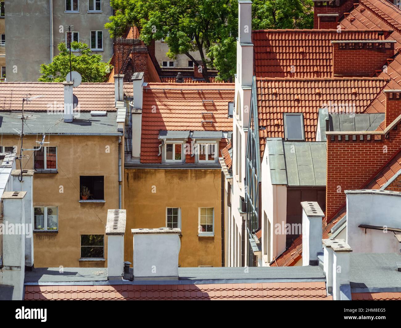 view from above on orange tiled rooftops of old medieval buildings of ...