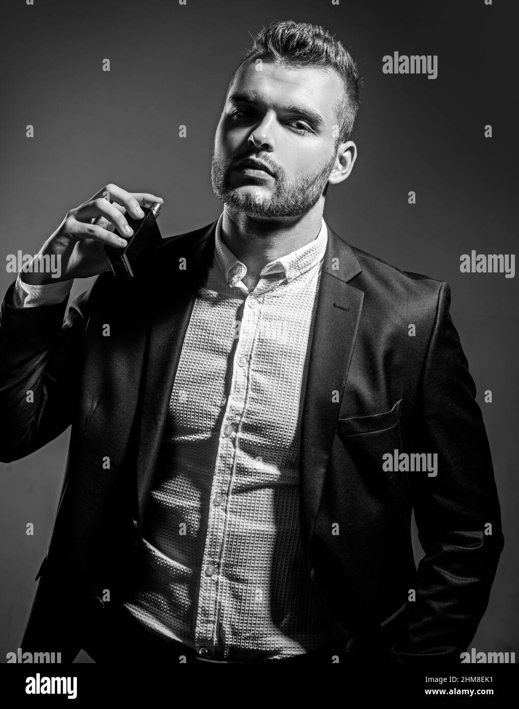 male smell. Man holding bottle of perfumery. Mans perfume concept ...