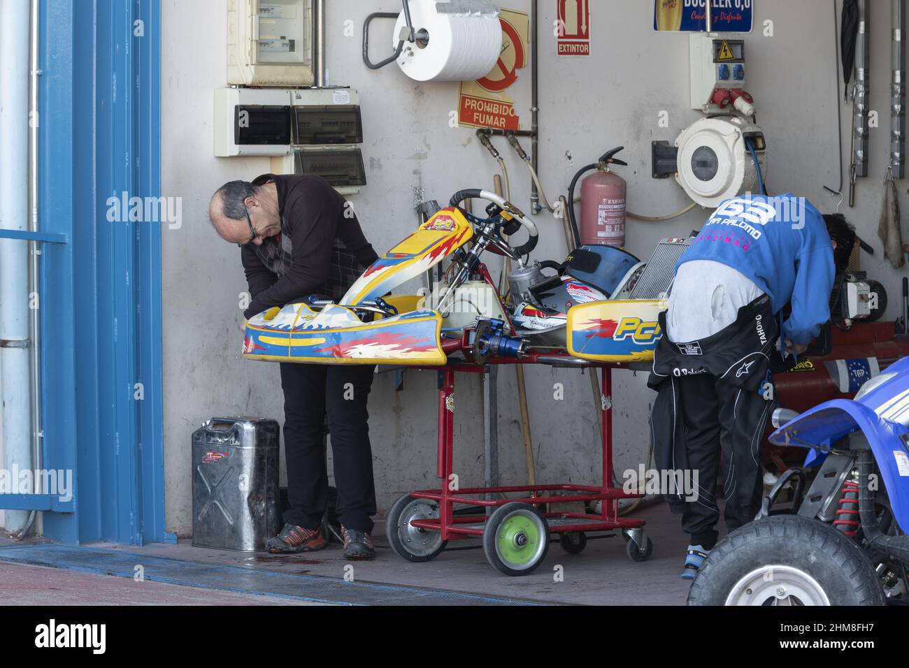 Mechanics fixing Go-carts in the pit for the race on circuit Stock ...