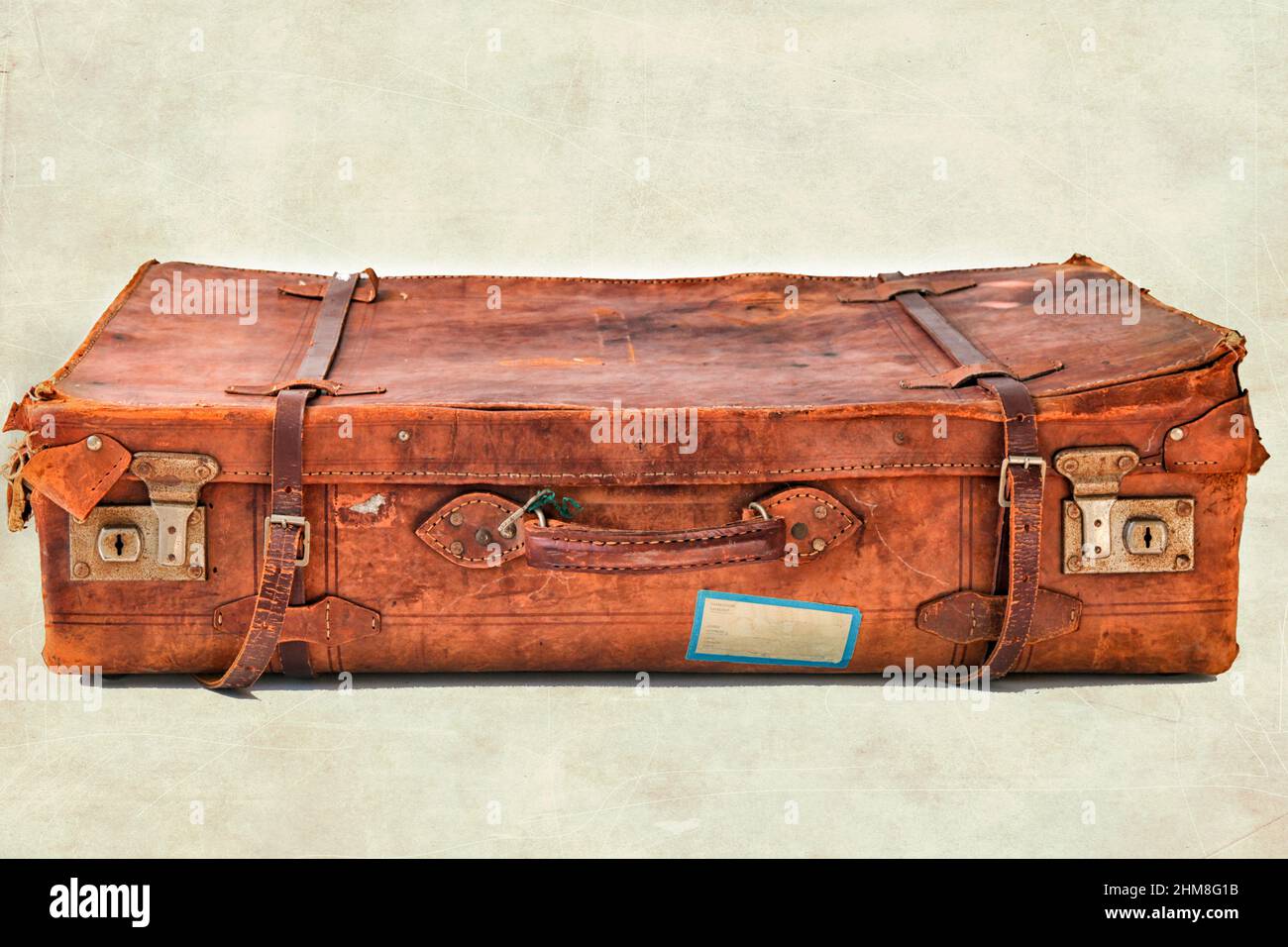 Isolated old and weathered leather suitcase lying down Stock Photo - Alamy