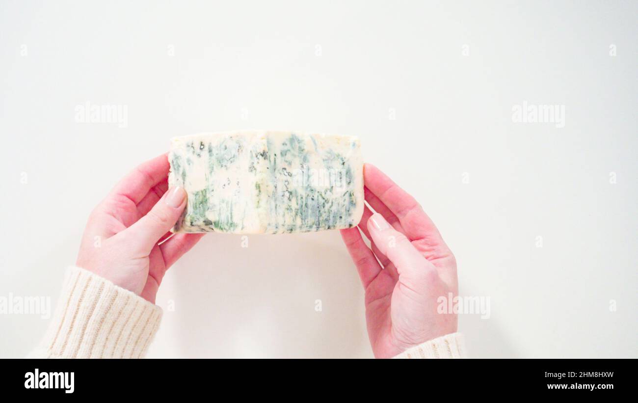 Flat lay. Large slice of gourmet cheese on a white background Stock ...
