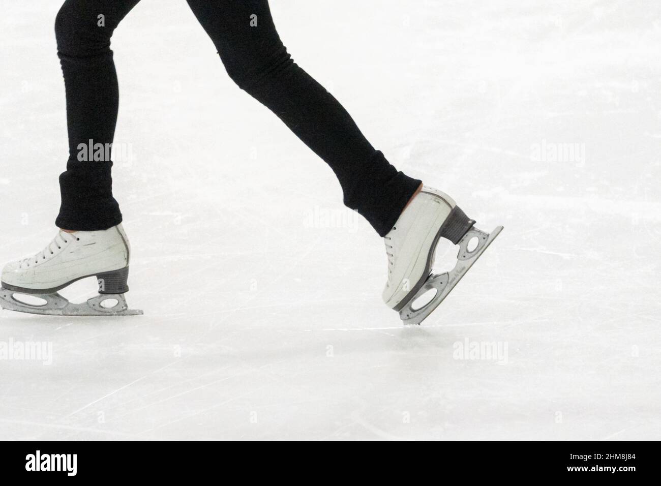 View of figure skater feet at the figure skating practice Stock Photo ...