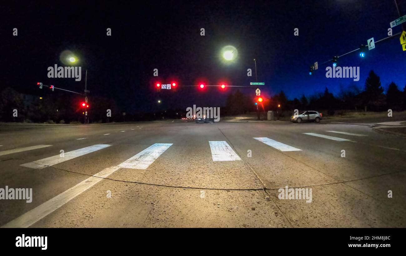 Driving on typical paved roads at night in suburban America Stock Photo ...
