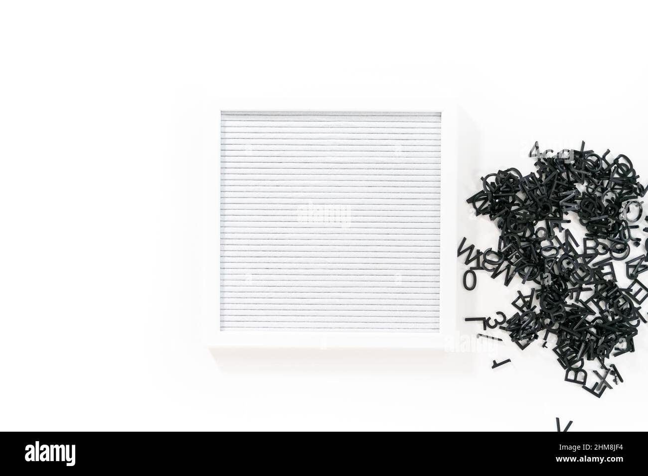 Empty message board with a pile of black letters and numbers Stock ...