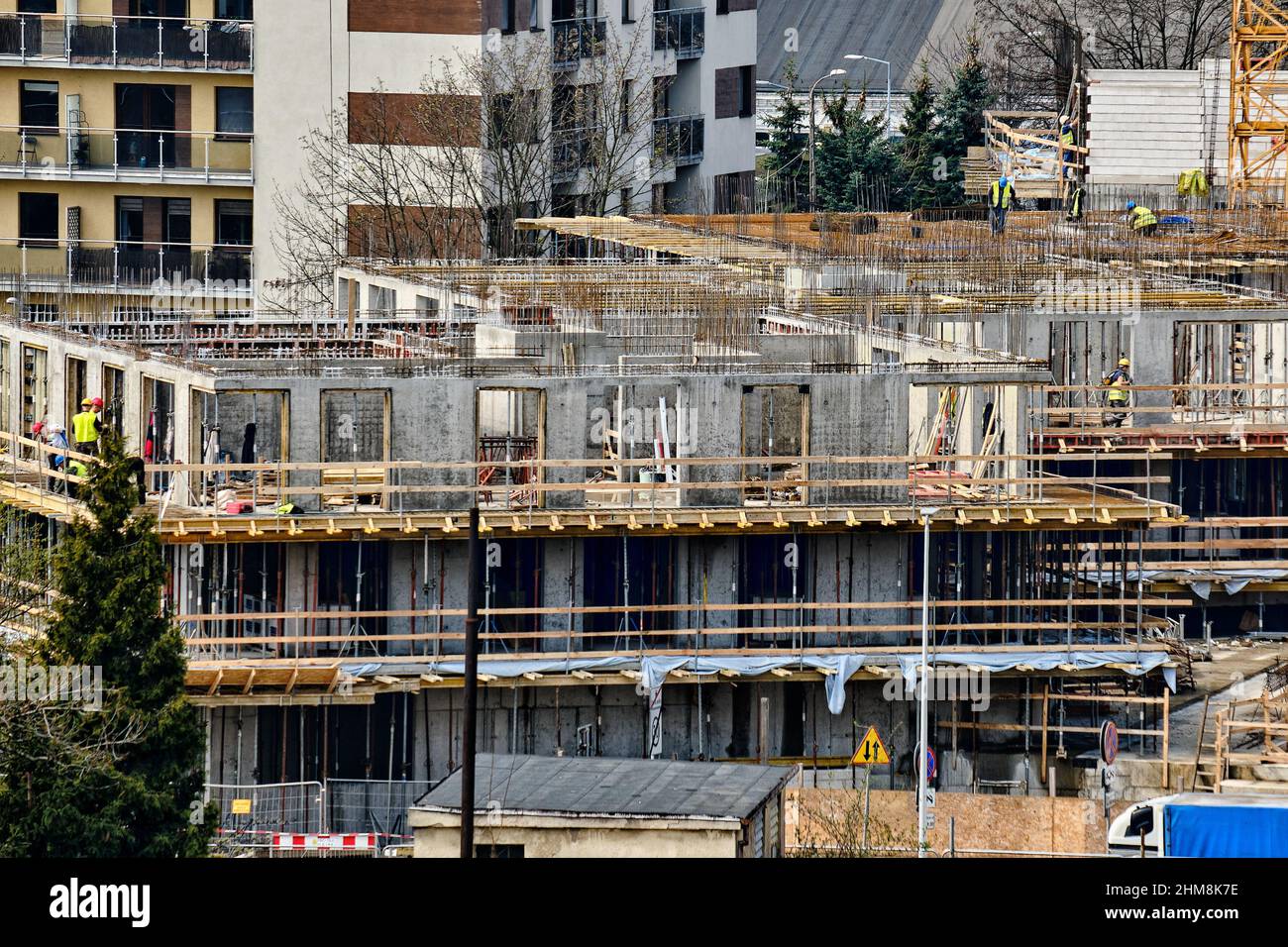 Construction workers install formwork and iron rebars or reinforcing ...