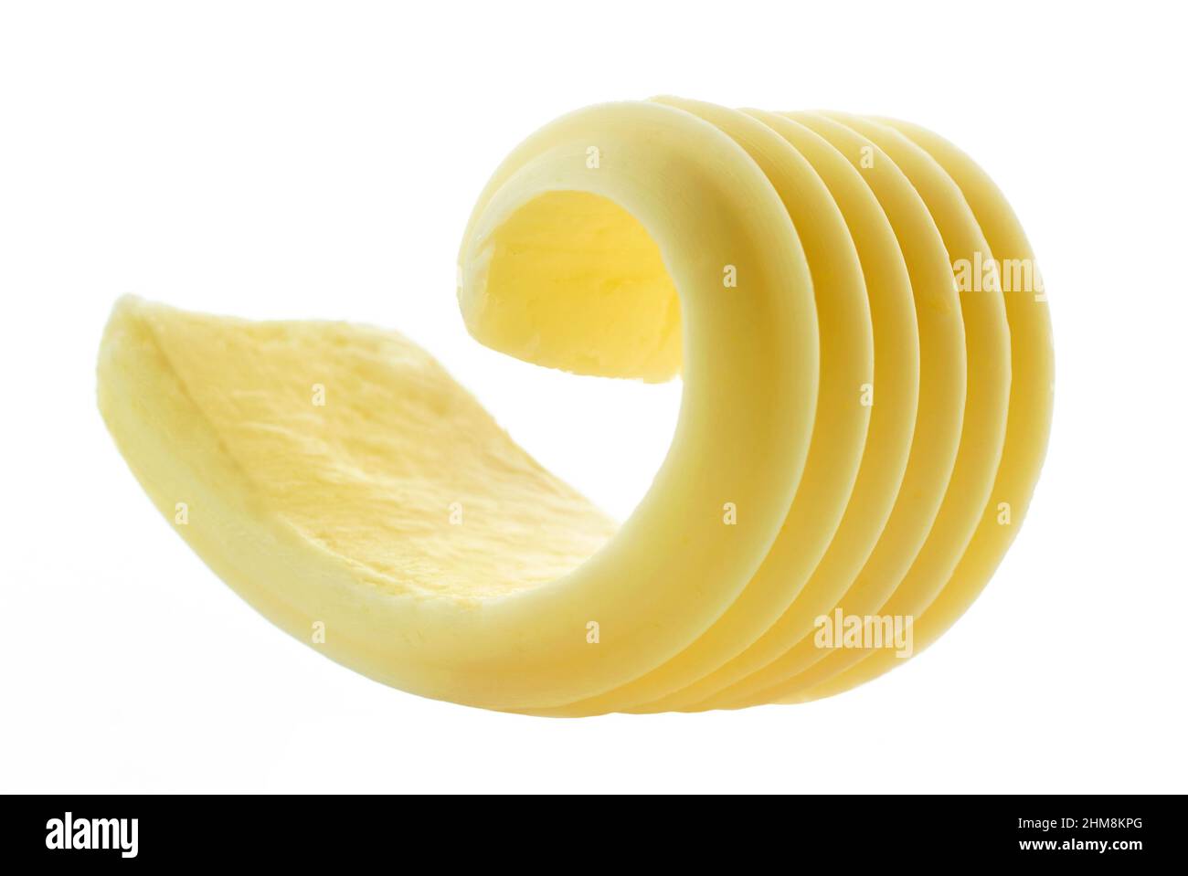 curl of fresh butter isolated on white background Stock Photo - Alamy