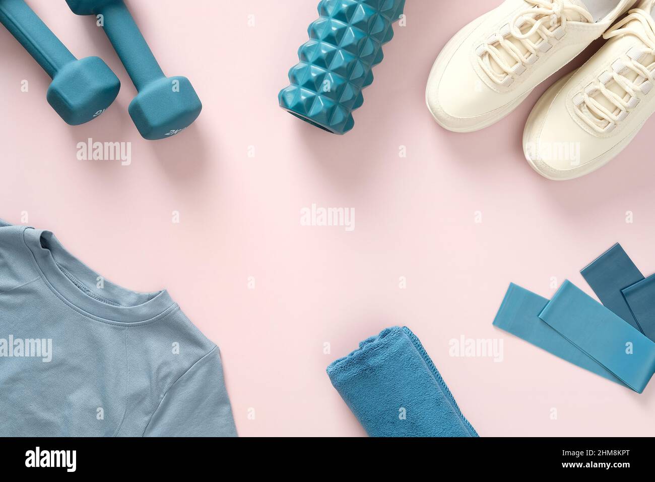 Sports equipment on pastel pink background. Feminine items and clothing ...