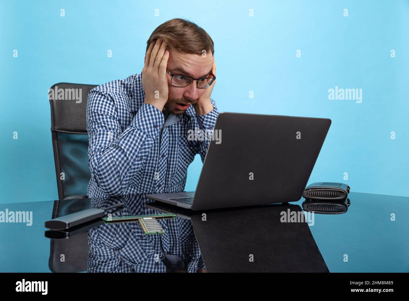 Portrait of man, computer system analyst touching head in shock ...