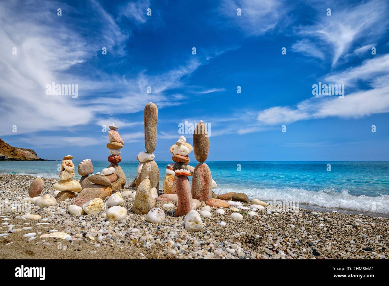 Group of balancing stones on beach. Bright sunny day, summer vibe ...