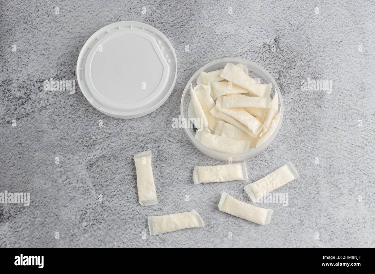 Swedish snus nicotine sachets. Open box with snus on a concrete ...