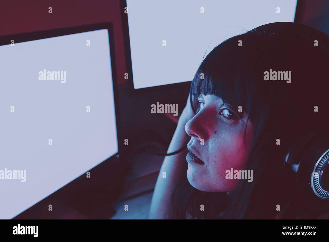 Young streamer woman working at night from home Stock Photo - Alamy