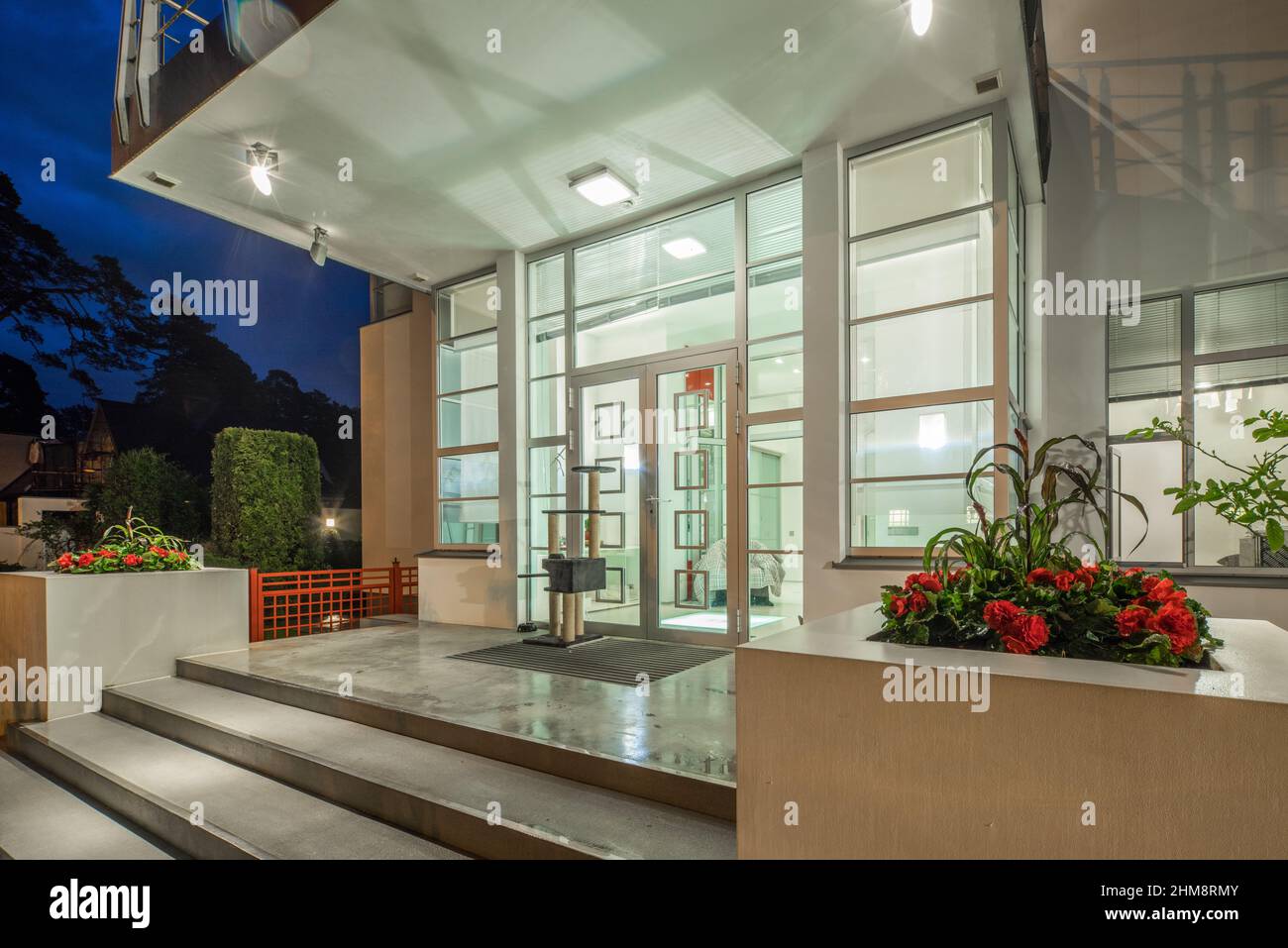 Modern exterior of luxury private house at twilight. View of entrance ...