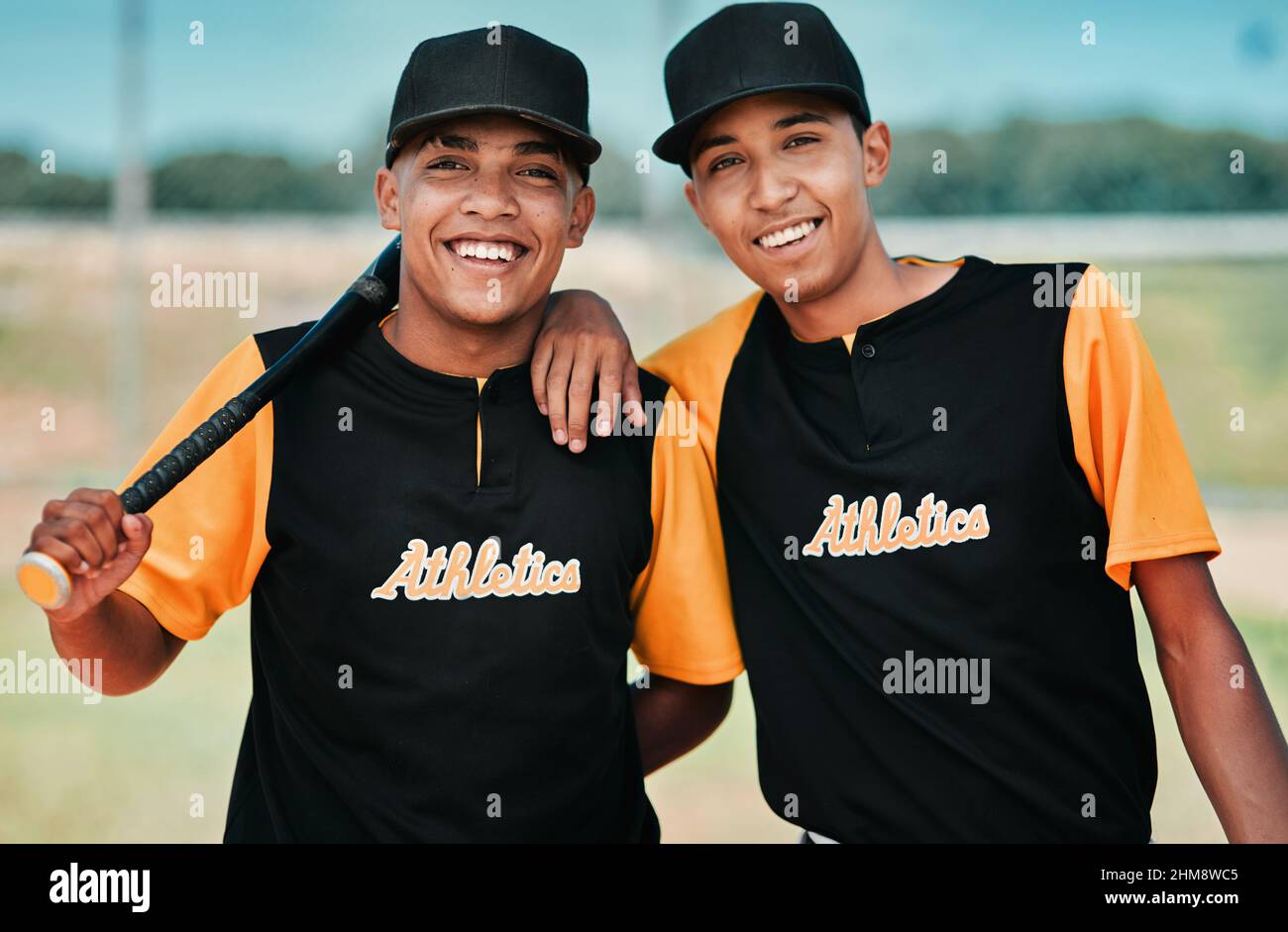 Nothing can keep us from playing. Portrait of two young baseball ...