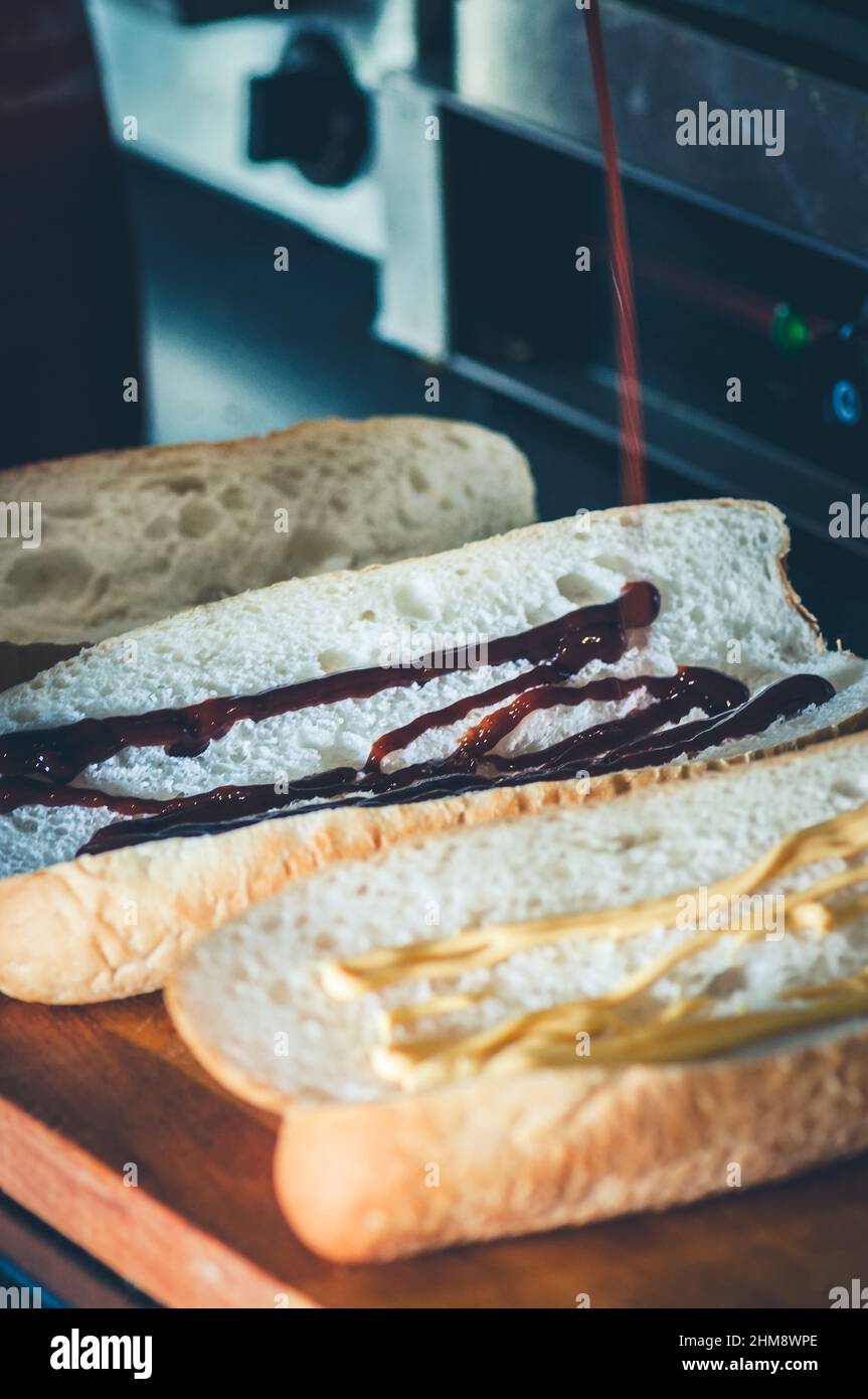 Sandwich in the making. Food preparing from food track concept Stock ...