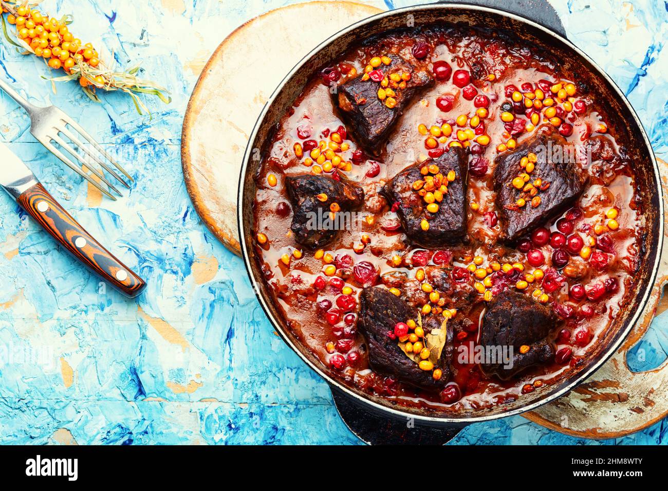 Pieces of beef stewed in sea buckthorn and cranberries Stock Photo - Alamy