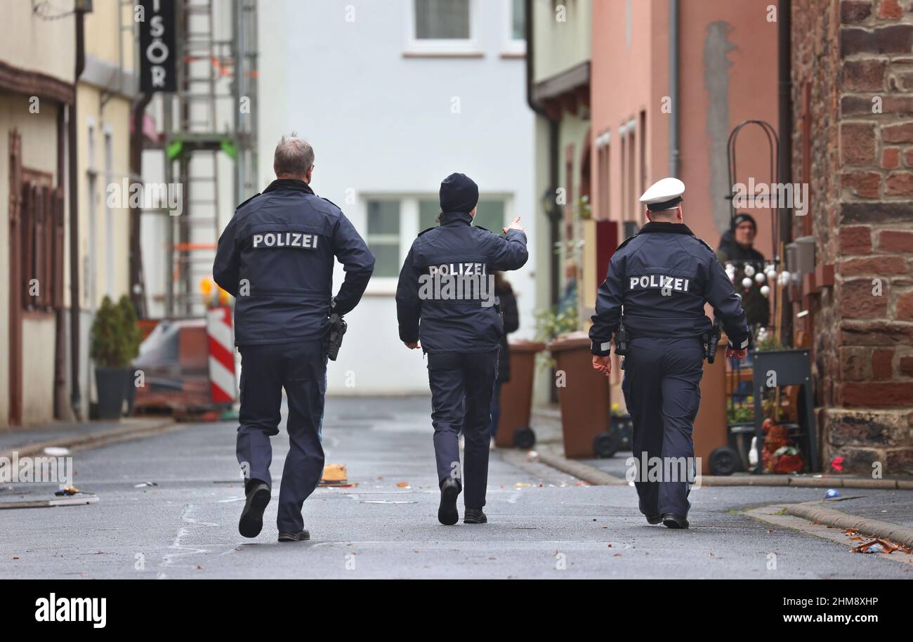 08 February 2022, Bavaria, Karlstadt: Police officers are running in an ...