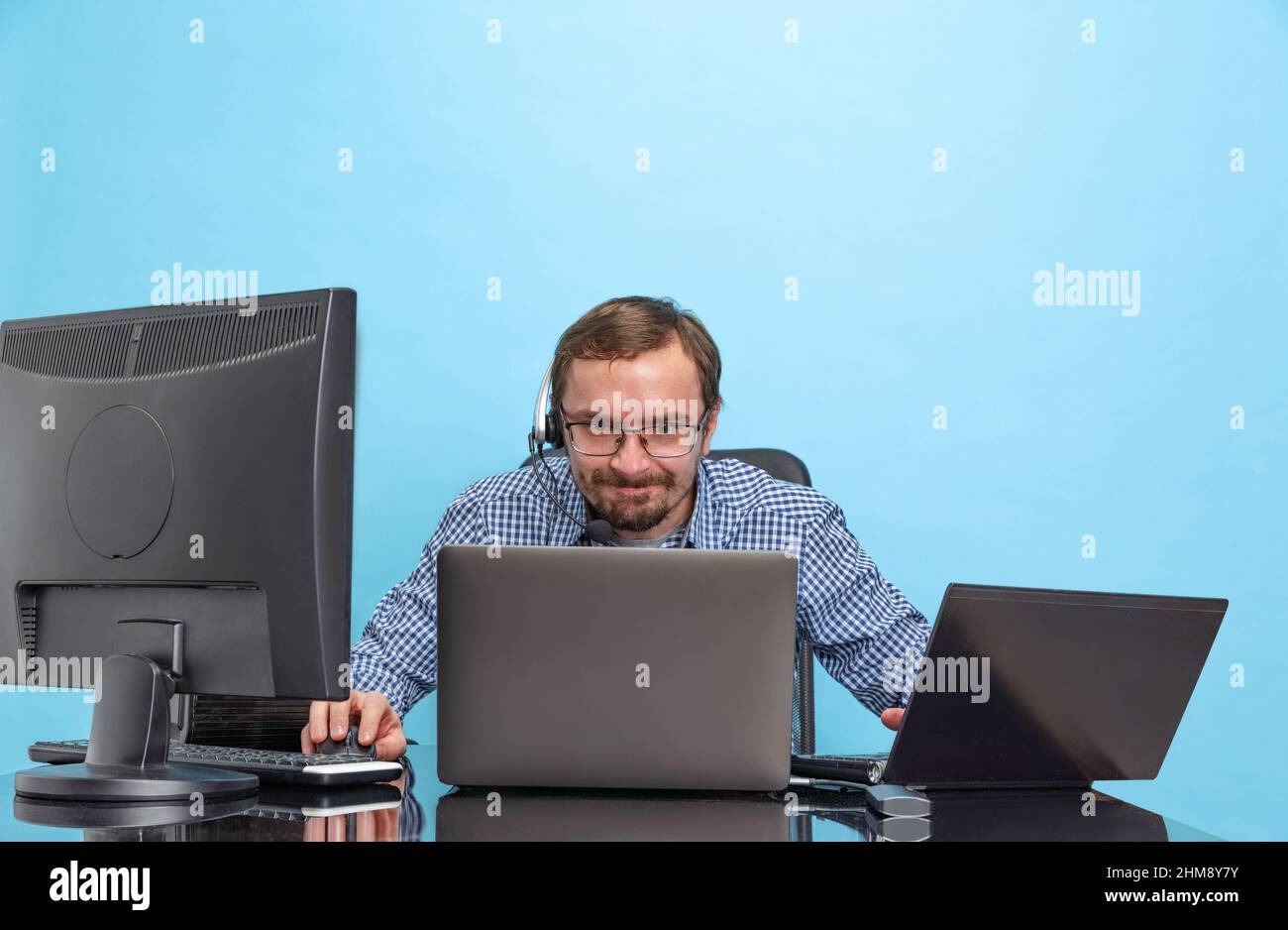 Portrait of concentrated man, programmer, computer system analyst ...