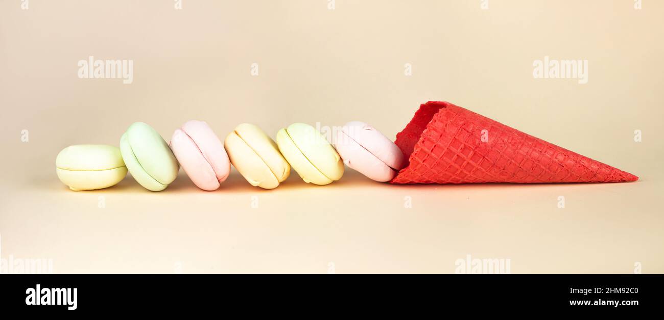 Red waffle cone with green, pink and yellow marshmallows looks like ...