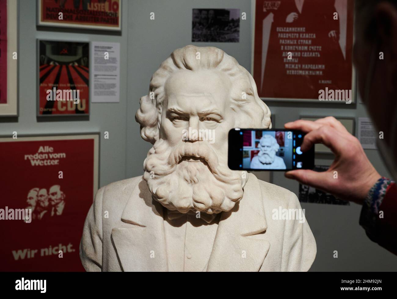 Berlin, Germany. 08th Feb, 2022. A person photographs the bust of Karl ...