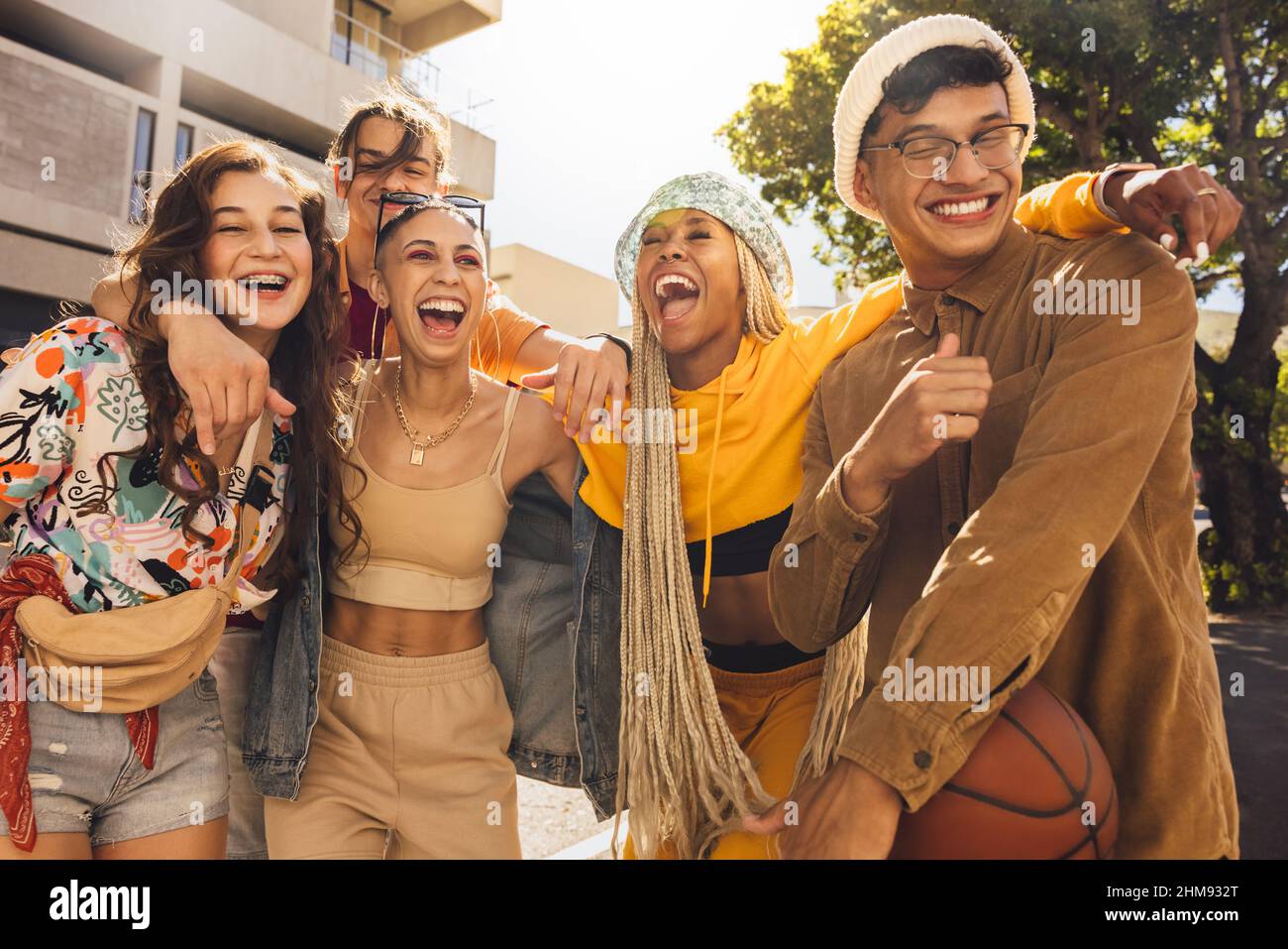 Group of generation z friends laughing together outdoors. Cheerful ...