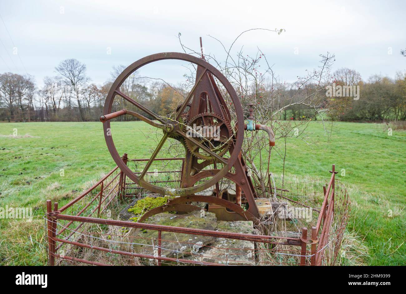Vintage cogs and wheels of disused, rusting agricultural farm machinery ...
