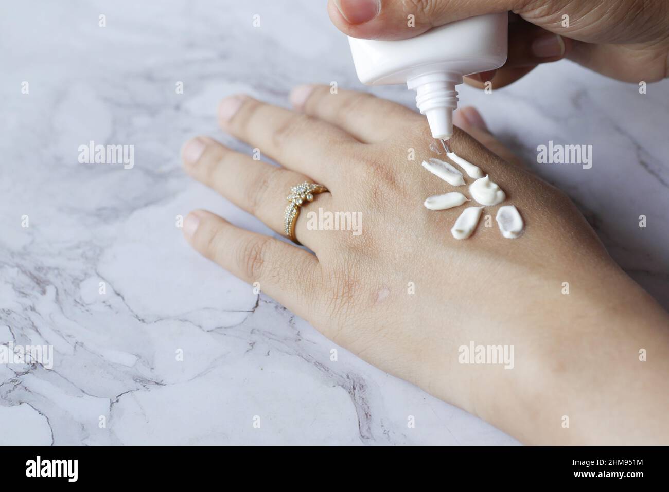 Apply sunscreen hi-res stock photography and images - Alamy
