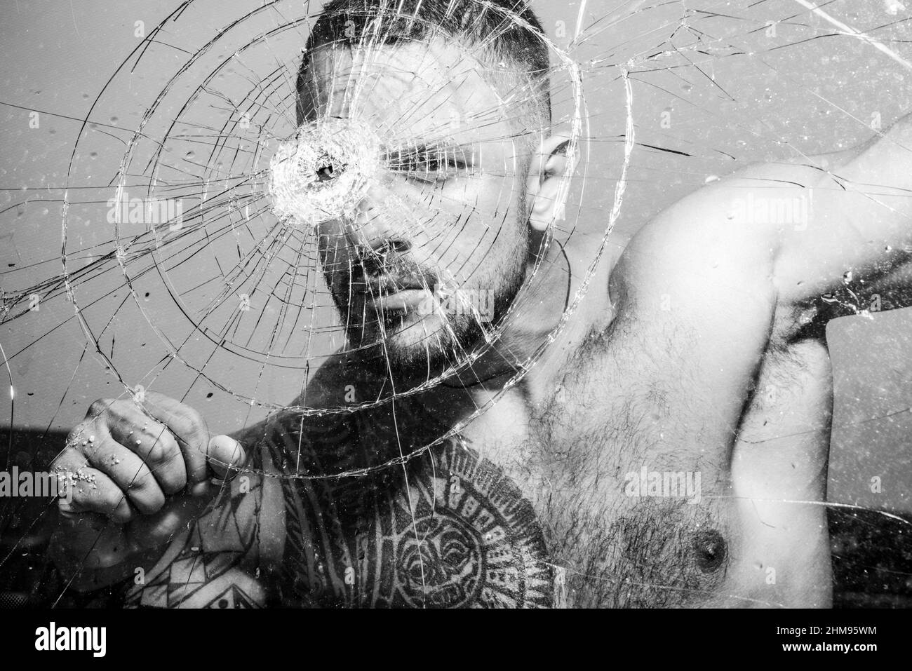 Gangster man. Dangerous criminal, hooligan guy on cracked bullet glass ...