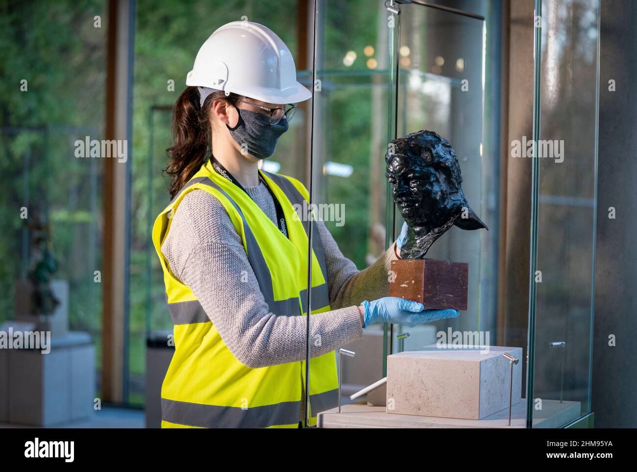 Objects conservator Sophie Philipps handles Balzac, a bronze created ...