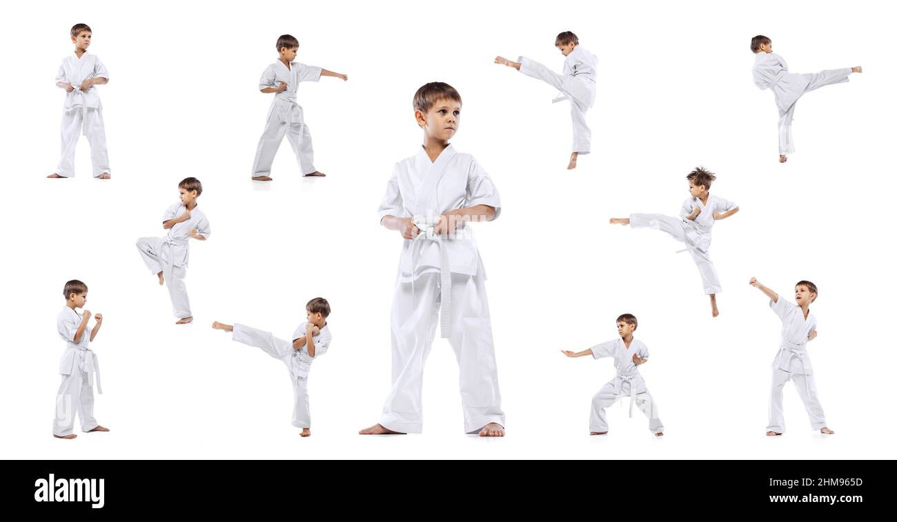Full-length portrait of little boy, motivated sportsman in white kimono ...