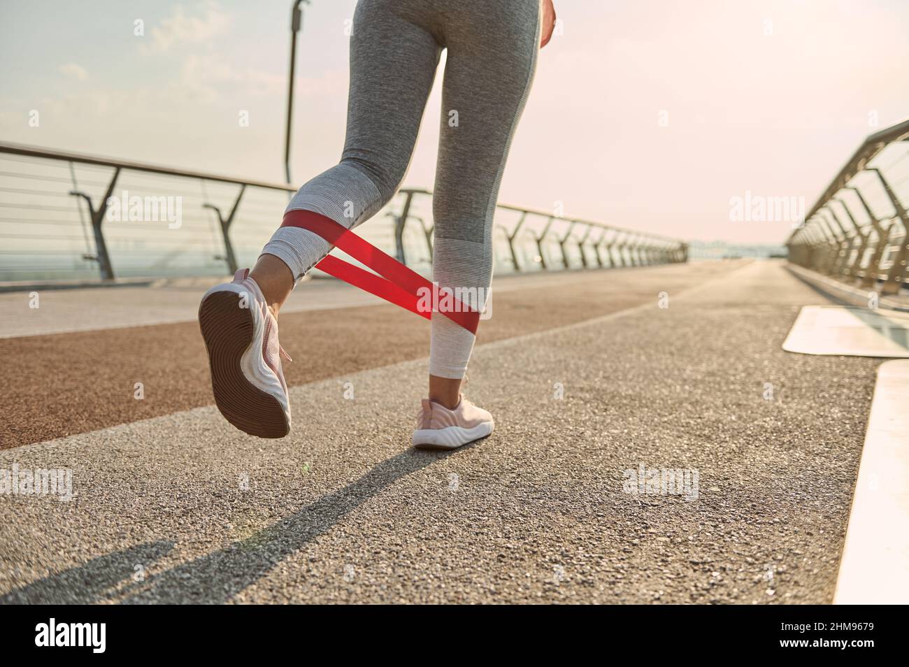 Close-up. Rear view of the legs of an athlete woman, sportswoman in ...