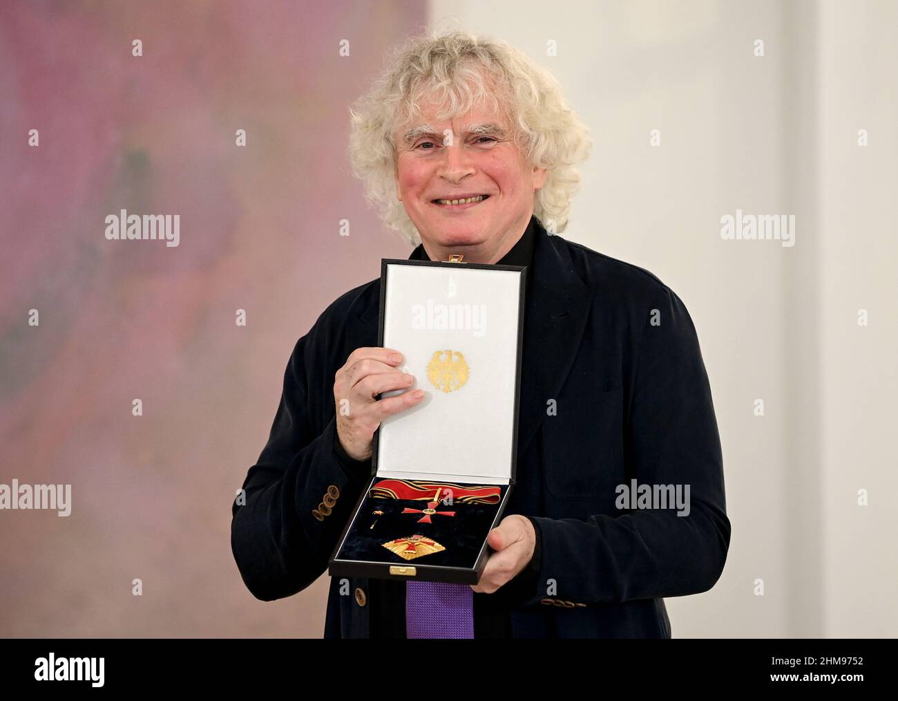 Berlin, Germany. 08th Feb, 2022. Sir Simon Rattle, conductor shows his ...