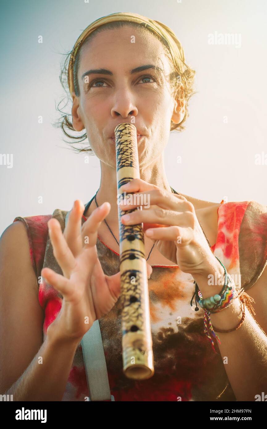 Young woman playing flute hi-res stock photography and images - Alamy