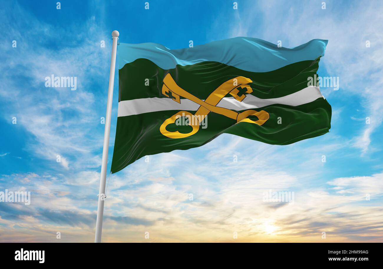 flag of Petersfield town , UK at cloudy sky background on sunset ...