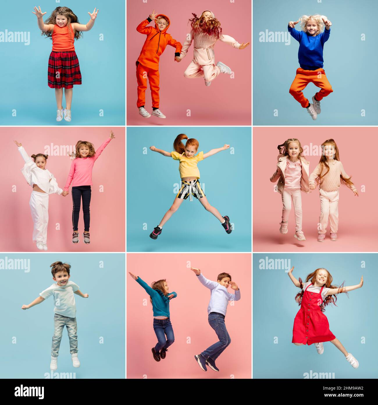 Group of elementary school kids or pupils jumping in colorful casual ...