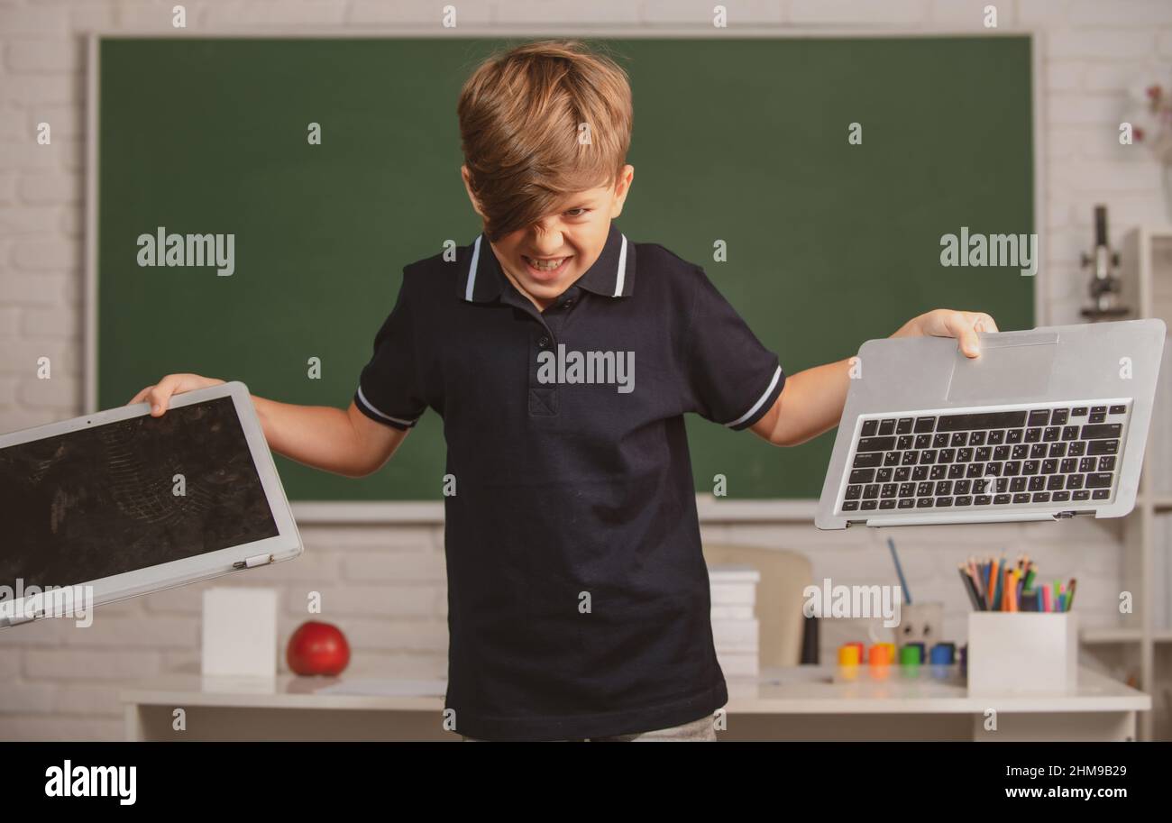Bad boy student vs distance education. Angry kid broken online laptop ...