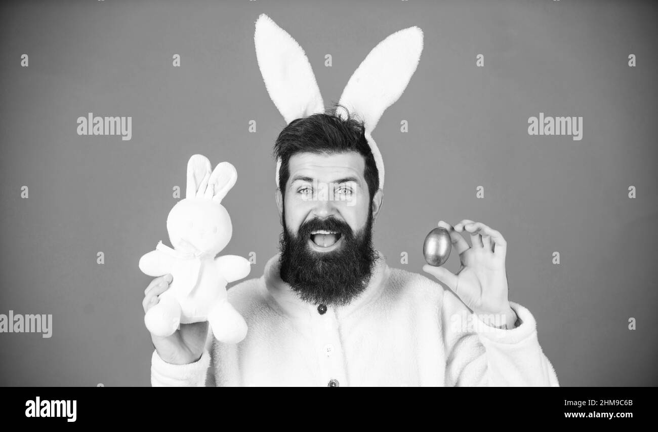 Easter when you are parent. Man handsome face wear white bunny ears ...