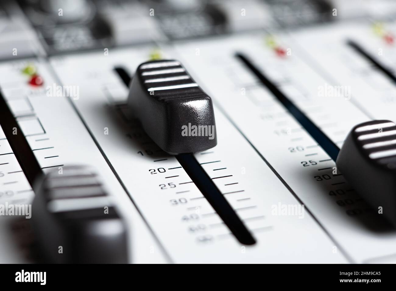 sound mixer and many faders close up music studio Stock Photo - Alamy