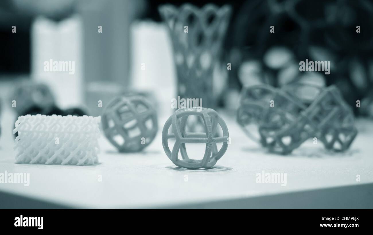 Abstract models printed by 3d printer close-up. Bright colorful objects ...