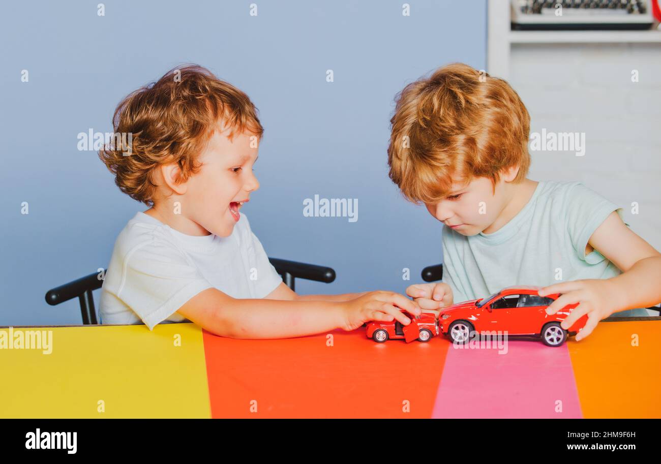 Children playing with toy car at kindergarten. Children pupils from ...