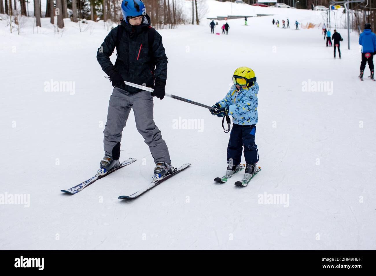 Father, teaching lttle toddler boy, preschool child, skiing for the ...
